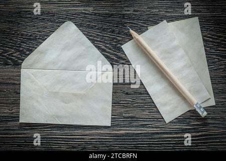 Vintage envelope paper pencil on black board top view Stock Photo - Alamy