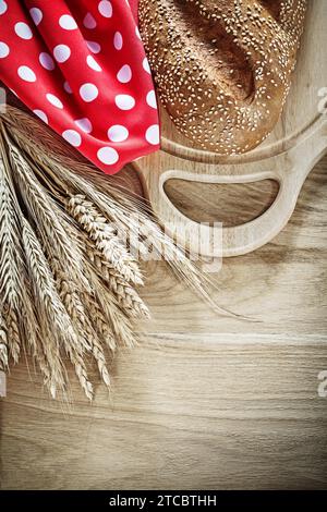 Bread wheat ears red polka-dot napkin on wooden board Stock Photo - Alamy