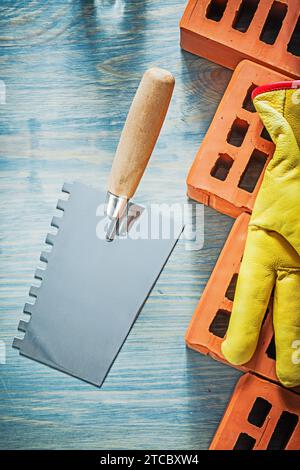 Red brick protective gloves palette knife construction level on ...