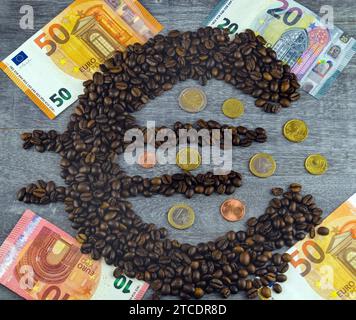 Euro sign, formed with roasted coffee beans, with Euro bills, coffee ...