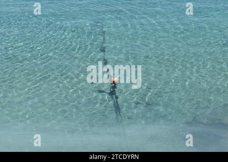 A single buoy floating in the ocean at sunset Stock Photo - Alamy