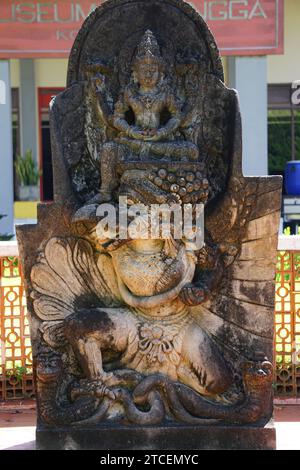 The statue of King Airlangga riding the Garuda Bird with its legs ...