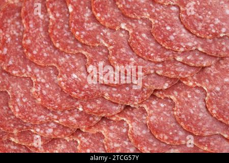 Sliced salami texture as a background, horizontal image Stock Photo - Alamy