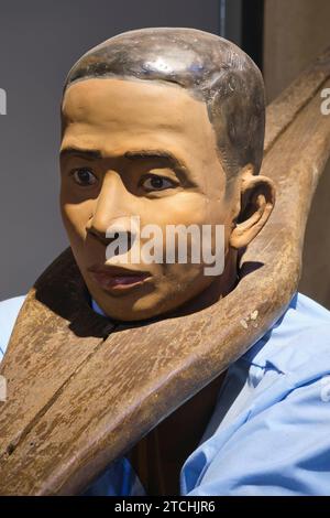 A display of a typical prisoner, locked in a Ta-ngok, a bamboo collar ...