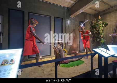 A display of an execution by sword, a beheading. The prisoner is ...