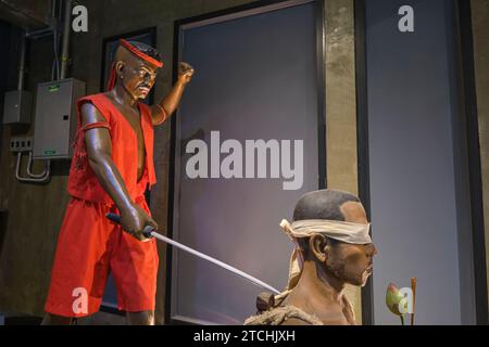 A display of an execution by sword, a beheading. The prisoner is ...