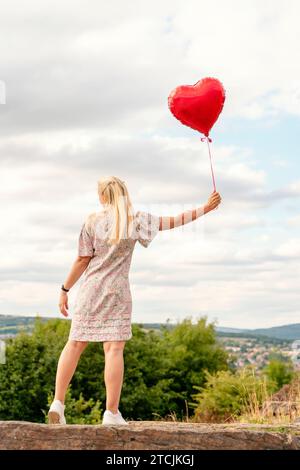 Heart design ribbon against blue background love minimal creative ...