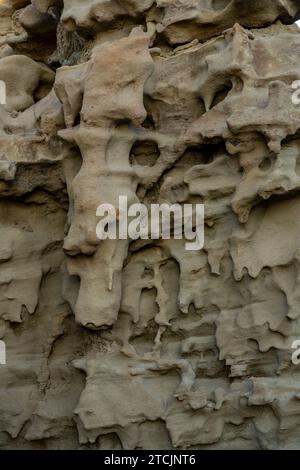 Melted wax-looking erosion patterns in the sandstone formations in ...