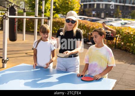 Cute girls playing ping-pong indoors Stock Photo - Alamy