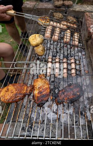 BBQ party, grilled suasage on a bbq trail, open flame Stock Photo - Alamy