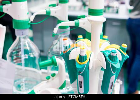 Chemical dispensers on a carousel stand Stock Photo - Alamy