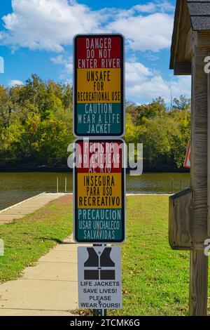 Danger signs in both English ad Spanish on the banks of the ...