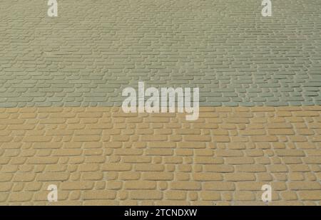 A detailed photo of the square, laid out of modern paving stone with ...