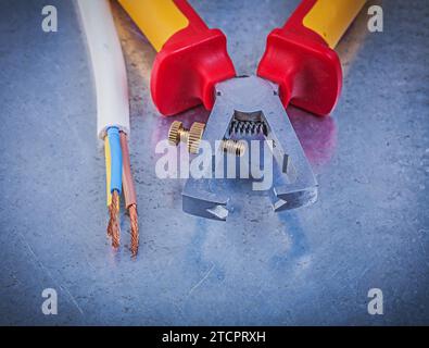 Insulated wire strippers Electrical wires on a metallic background ...