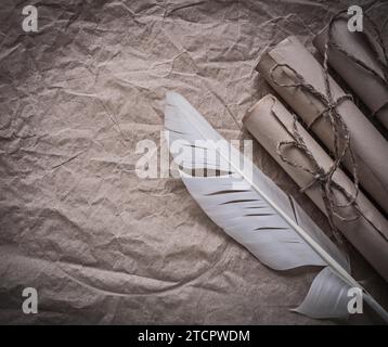 Pile of old paper rolls on crumpled packaging paper Stock Photo - Alamy