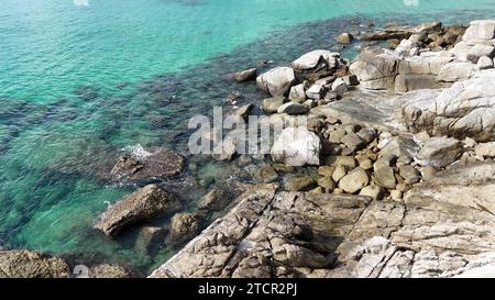 calm turquoise sea and rocky shore Stock Photo - Alamy