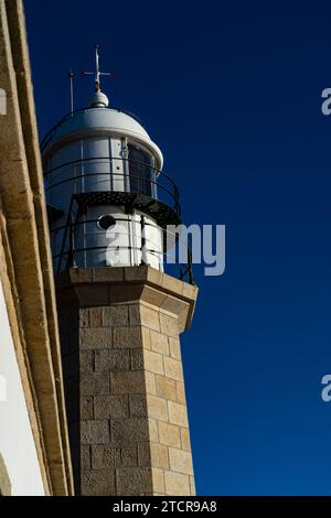Larino lighthouse in Galicia, Spain against the sky Stock Photo - Alamy