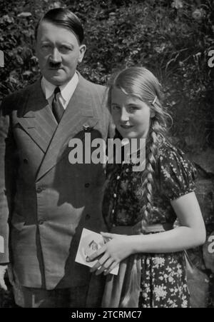 Adolf Hitler and a young girl, German propaganda photo Stock Photo - Alamy
