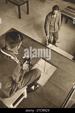In the photograph, recruits of the Luftwaffe, the German Air Force, are ...