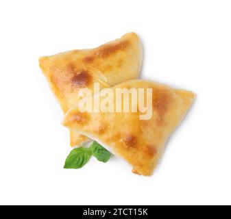 Delicious samosa and basil isolated on white, top view Stock Photo - Alamy