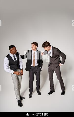 jolly diverse friends in business attire with sunglasses posing ...