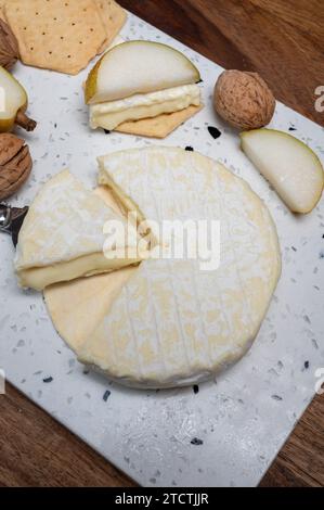 French soft Cremeux de Normandie cheese, soft creamy cheese with white ...