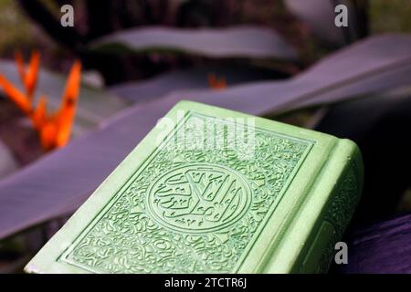 The Quran, holy book of Muslims from God with Allah monogram. Symbols ...