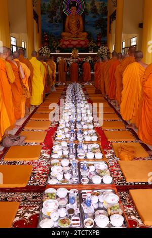 Vegetarian meal, Monks at Buddhist ceremony in the main hall, Phuoc Hue ...