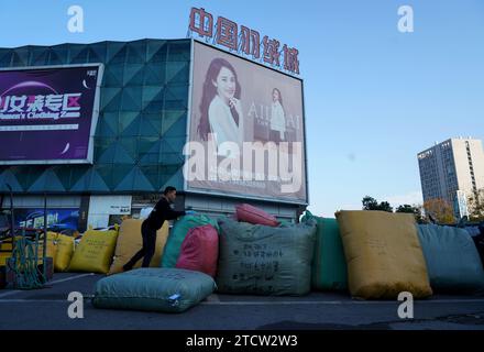Pinghu, China's Zhejiang Province. 14th Dec, 2023. A costume designer ...