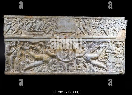 A marble sarcophagus decorated with erotes (winged cherubic figures ...