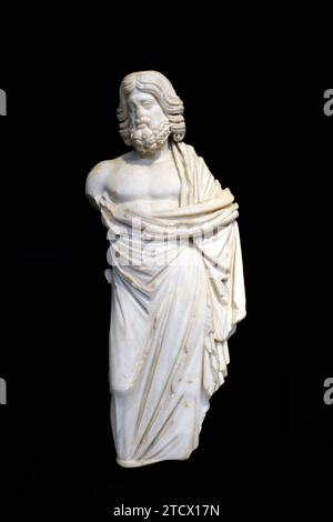 Statue of Aesculapius the Roman God of Medicine standing in the Louvre Museum in Paris France ...