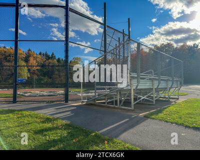 View of typical angle frame bleacher and backstop at a nondescript high ...