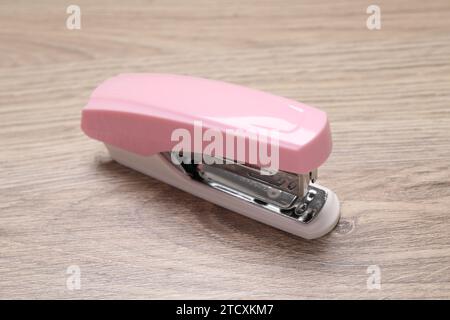 One new stapler on pink background, top view Stock Photo - Alamy