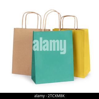 Three paper shopping bags on white background Stock Photo - Alamy