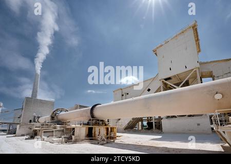 Tubular rotary furnace and smoking chimney at factory Stock Photo - Alamy