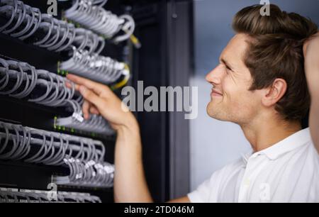 Server room, man and check cables with smile, thinking and connectivity ...