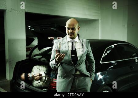 Man in trunk of car, kidnapping and gun with mafia, danger and violence ...