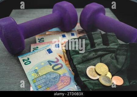 money, dumbbells and workout glove, symbol for fitness costs Stock ...