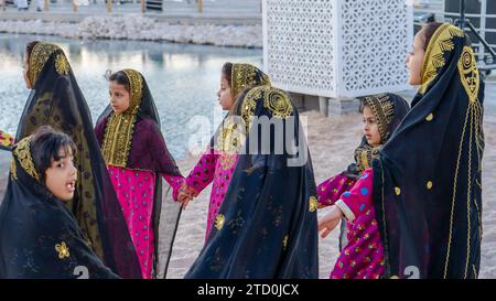 Doha, qatar- December 18, 2023 : Qatari girls in their national attire ...