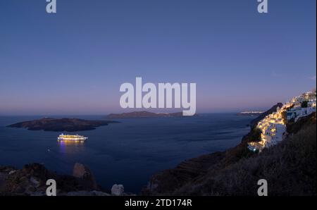 Dawn comes to the caldera of Santorini, from Fira, Greece Stock Photo ...