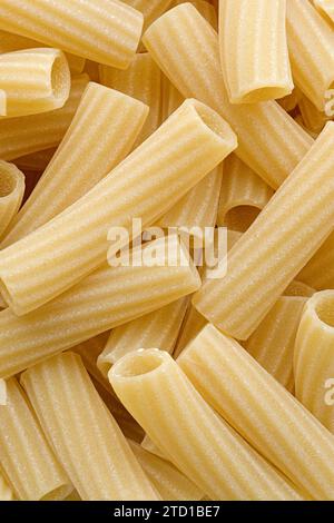 Italian cuisine - raw dry tortiglioni pasta Stock Photo - Alamy