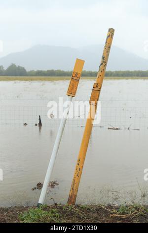 Telstra telecon poles begin to fall after flood erosion in the Cairns ...