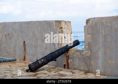 Firkas Fortress worn wall, antique cannon on paved yard at Old Town of ...