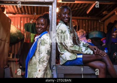 Models are posed for a photo at Richard Onyango's stall all dressed in ...