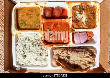 Punjabi thali in box. Indian lunch food parcel. Punjabi thaali of roti ...