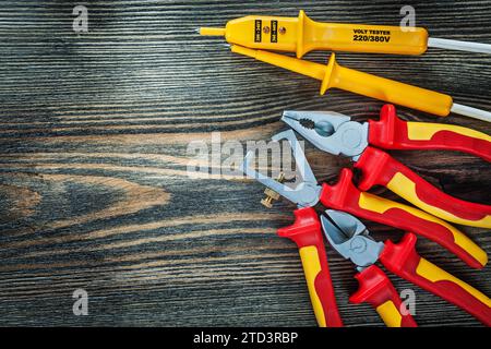 Electric tester nippers insulated strippers on wooden board Stock Photo ...