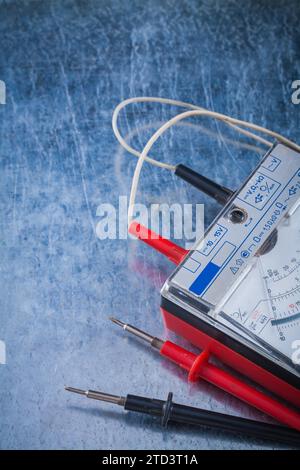 Electrician’s multimeter on scratched metallic surface construction ...