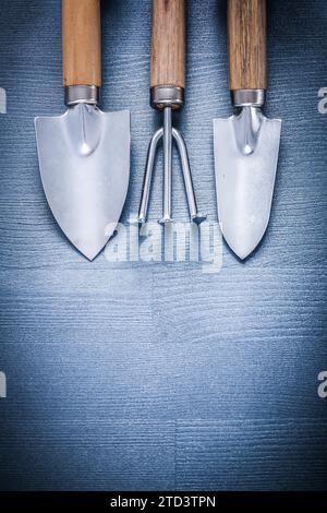 vertical version two garden spades and fork Stock Photo - Alamy