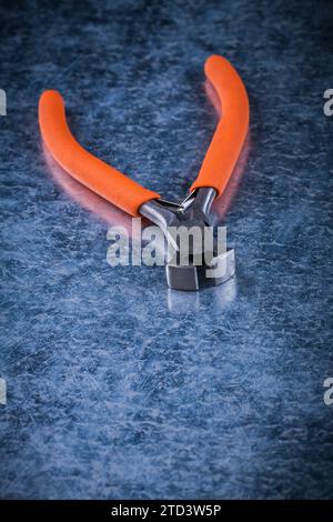 Insulated electric wire cutter on metallic background electricity ...