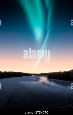 Beautiful northern lights over lake Stock Photo - Alamy